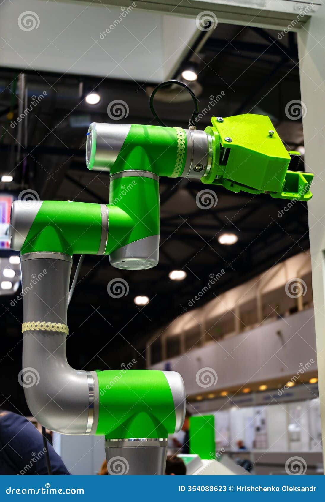 Green Collaborative Robotic Arm in an Industrial Environment. Stock ...