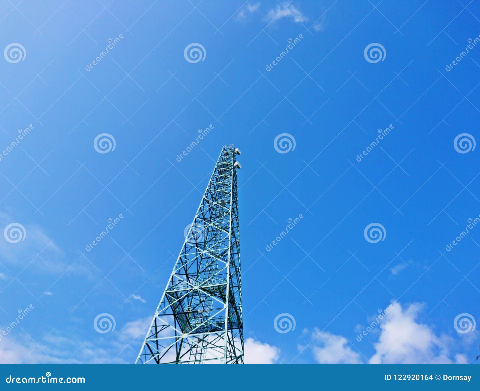 Green Colour of Telecommunication Tower Antenna on Blue Sky Background ...