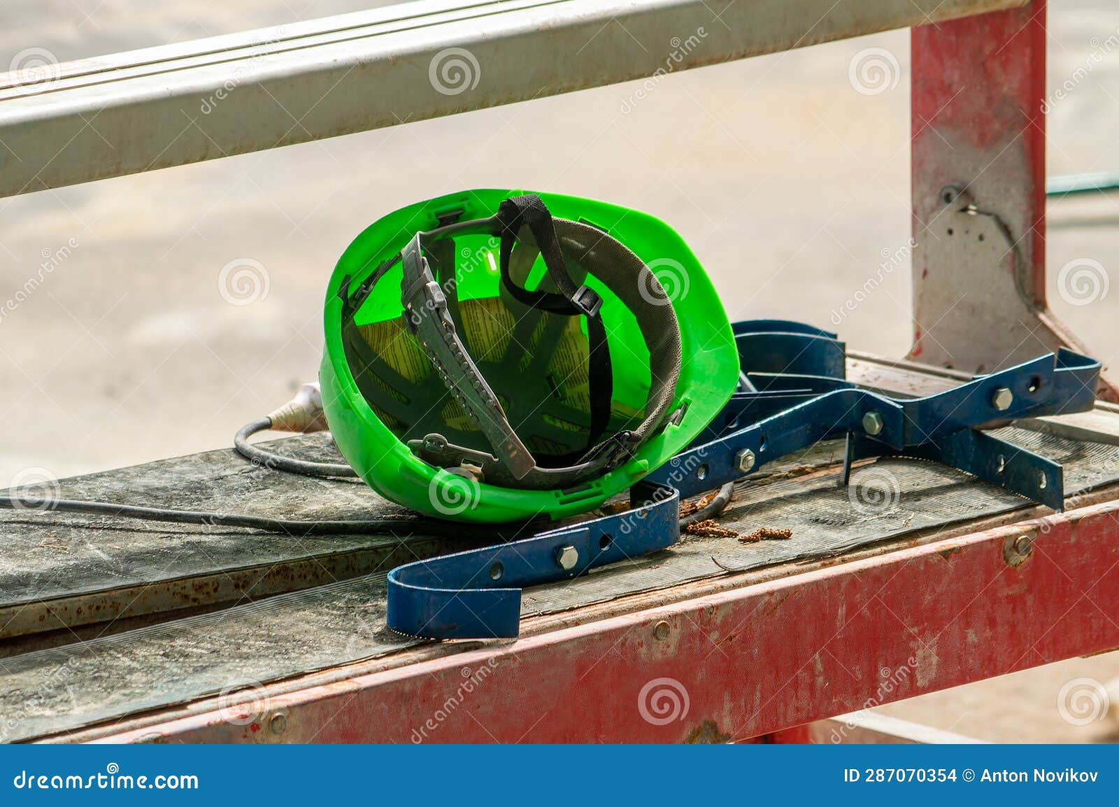Green Construction Helmet on the Machine. Construction Site Stock Photo ...