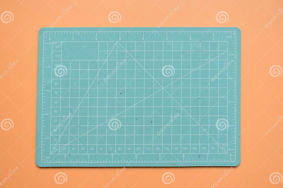 Green Cutting Mat on Orange Background, Object Tool for Design Stock ...
