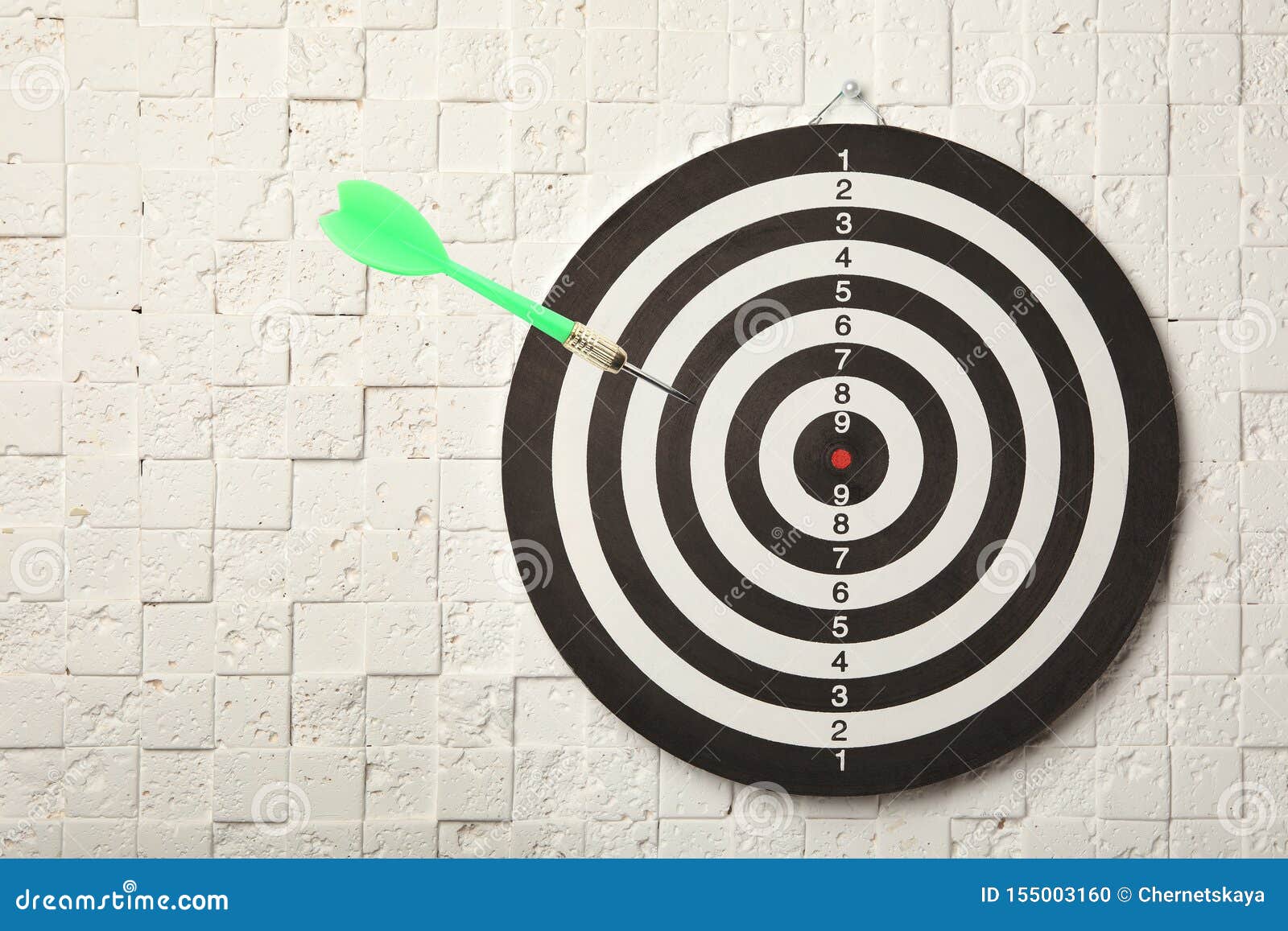 Green Dart and Board on Textured Stock Photo - Image of background ...