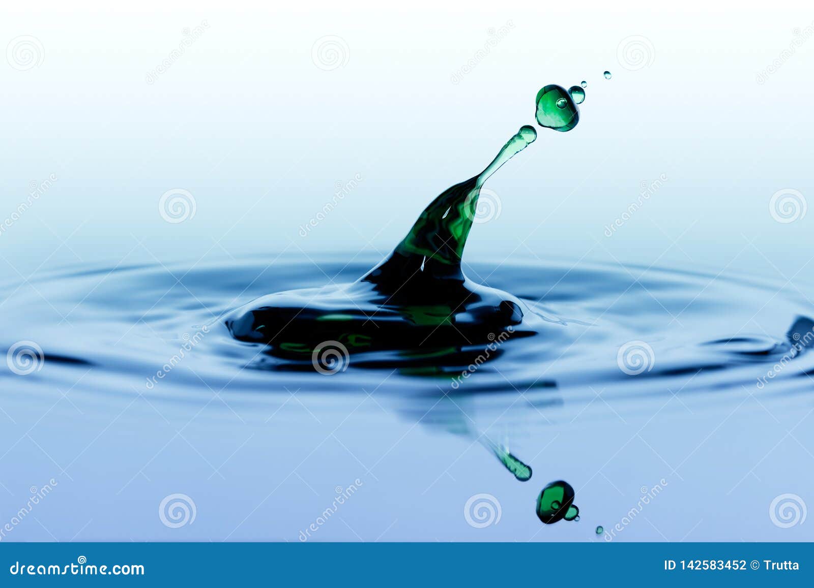 Green Drop Falling on Smooth Surface of Water Stock Photo - Image of ...