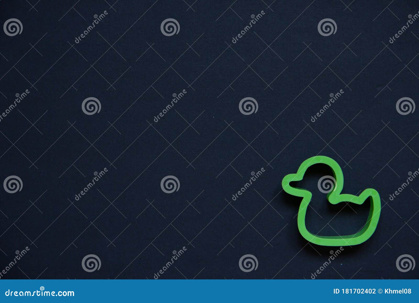 The Green Duck Toy Shape On A Black Plate. The Form For The Test On A ...