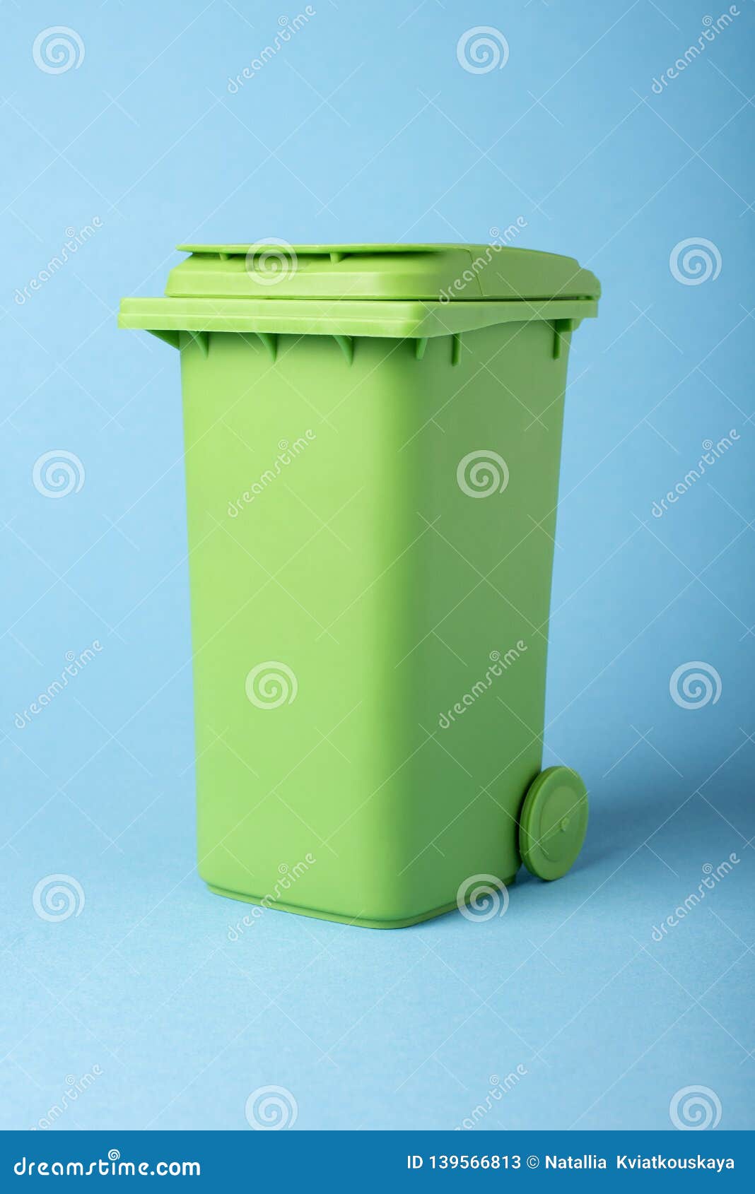 Green Dustbin on a Blue Background Stock Image - Image of environmental ...