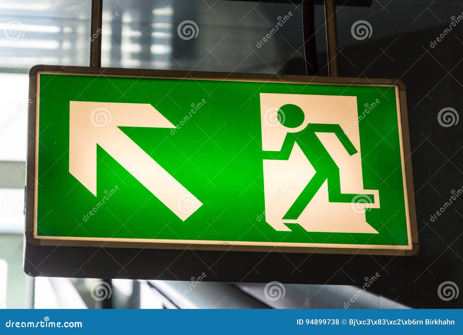A Green Emergency Exit Sign Close Up Stock Photo - Image of symbol ...