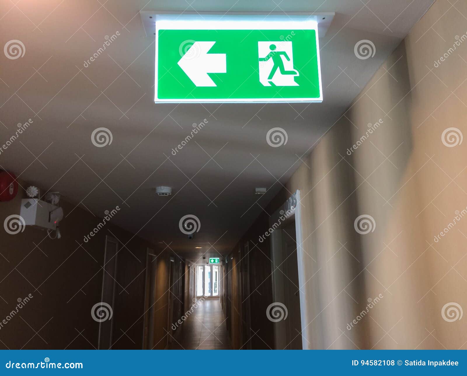 Green emergency exit sign. stock photo. Image of building - 94582108