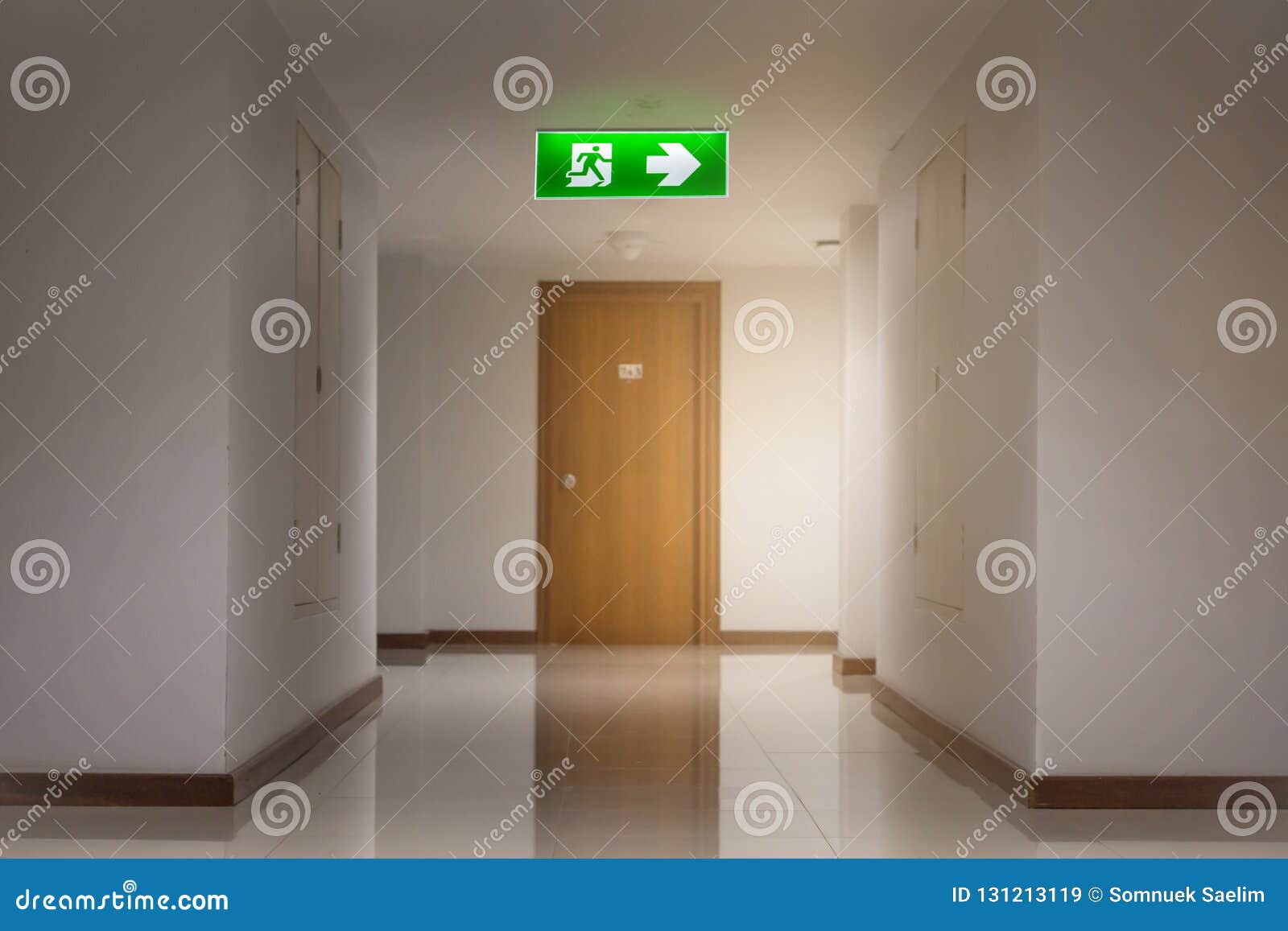 Theâ€‹ Green Emergency Exit Sign in Hotel Showing the Way To Escape ...