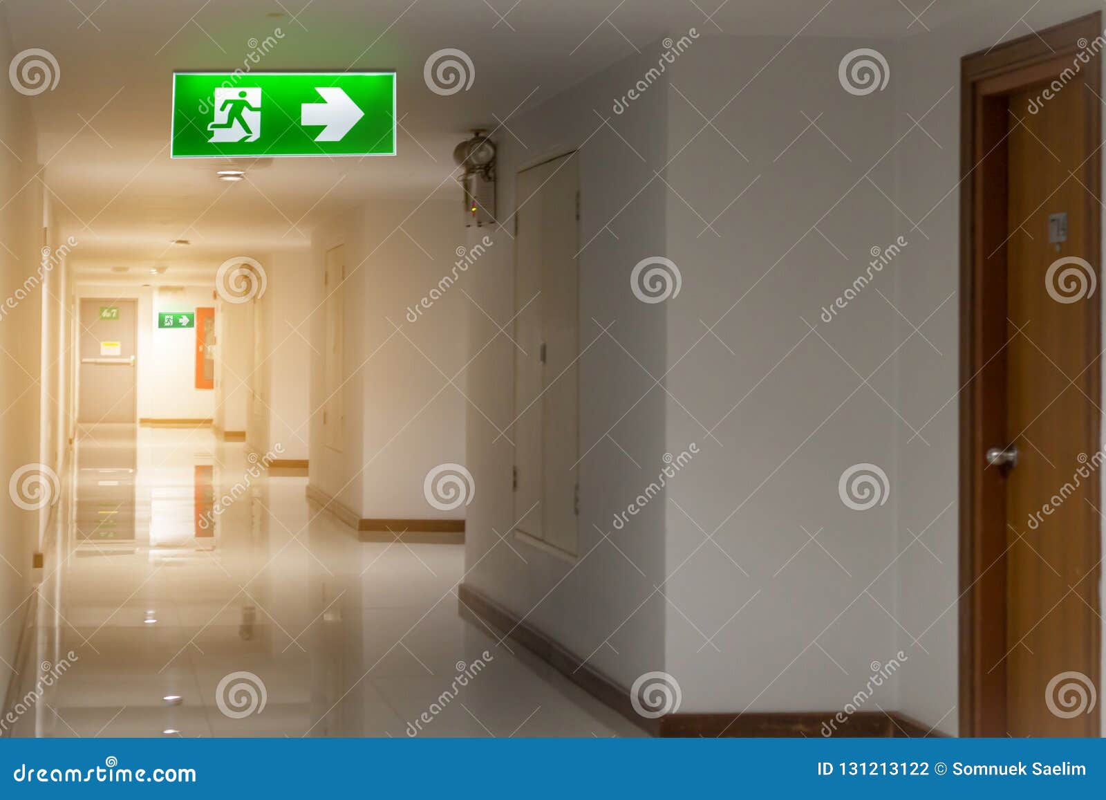 Theâ€‹ Green Emergency Exit Sign in Hotel Showing the Way To Escape ...