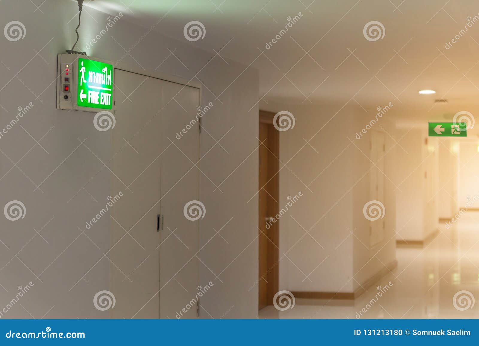 Theâ€‹ Green Emergency Exit Sign in Hotel Showing the Way To Escape ...