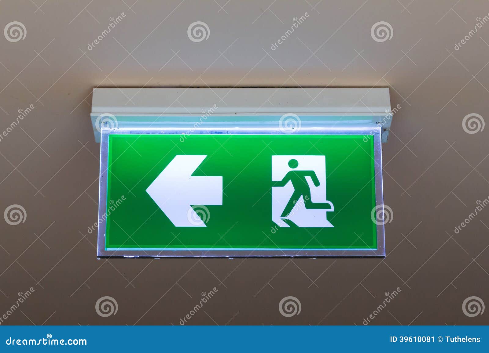 Green Emergency Exit Sign Showing The Way To Escape.Fire Exit In The ...