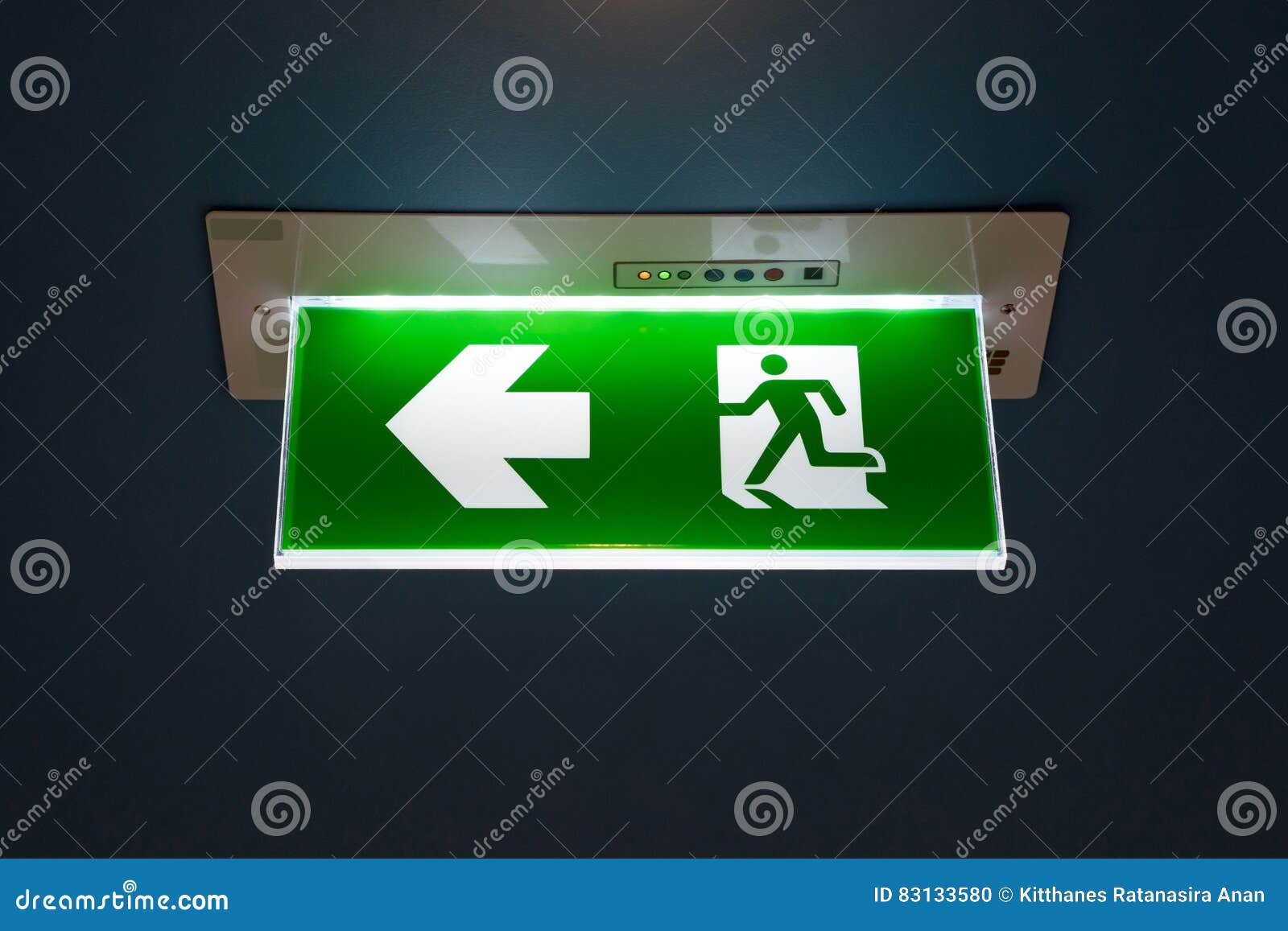 Green Emergency Exit Sign Showing the Way To Escape. Stock Photo ...