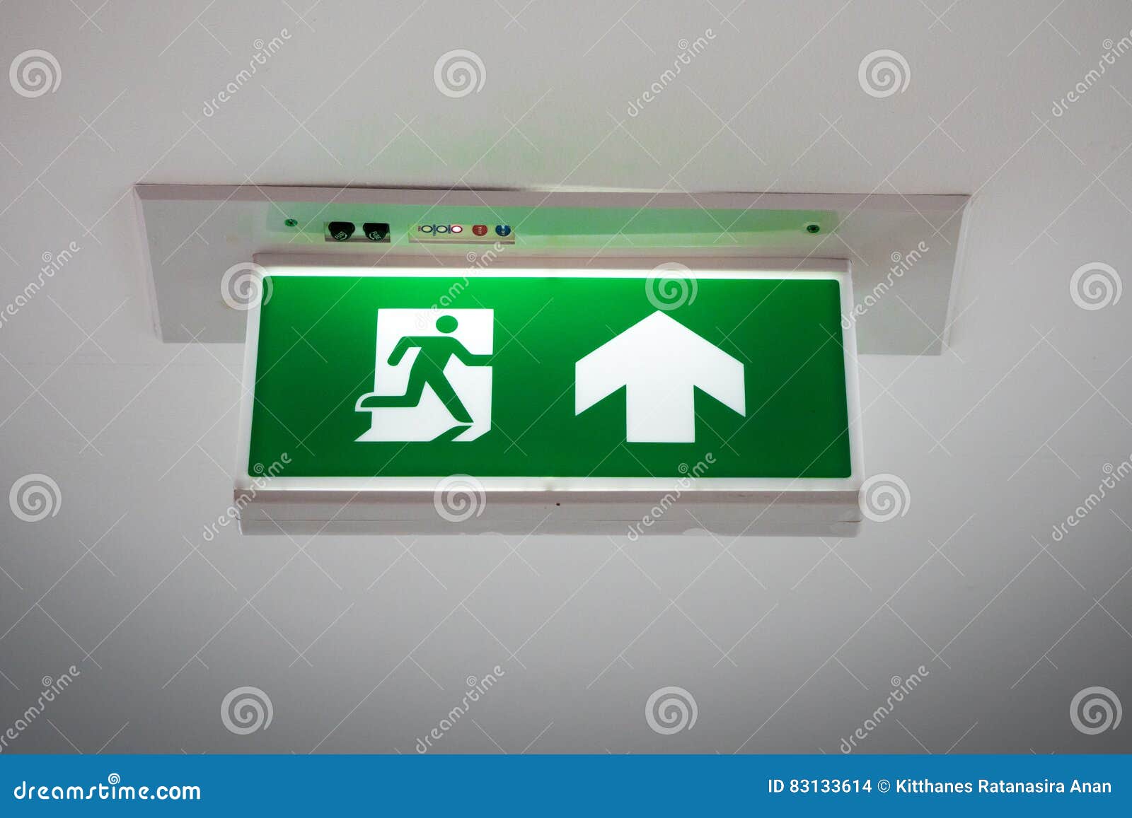 Green Emergency Exit Sign Showing the Way To Escape. Stock Photo ...