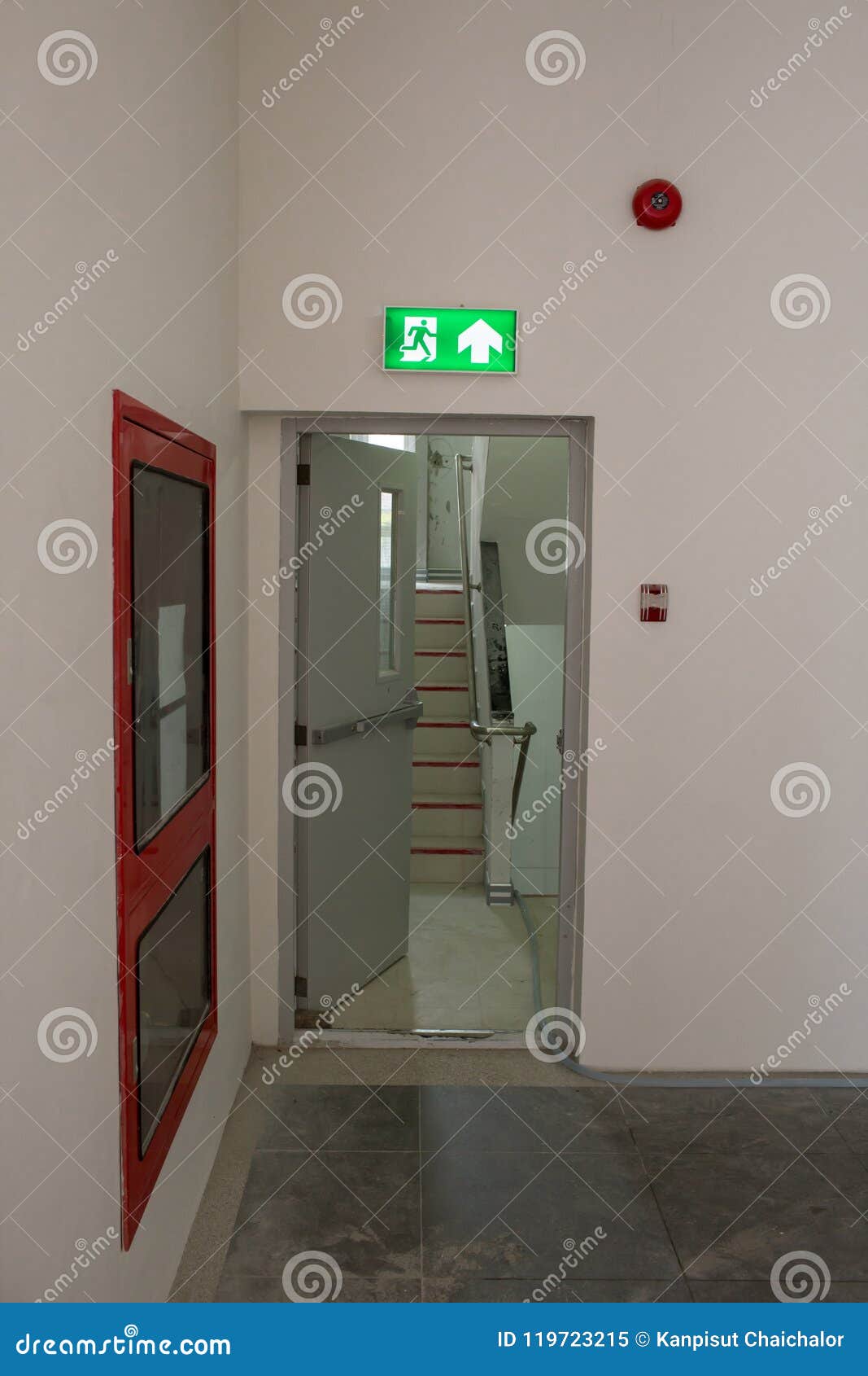 Green Emergency Exit Sign Showing The Way To Escape.Fire Exit In The ...