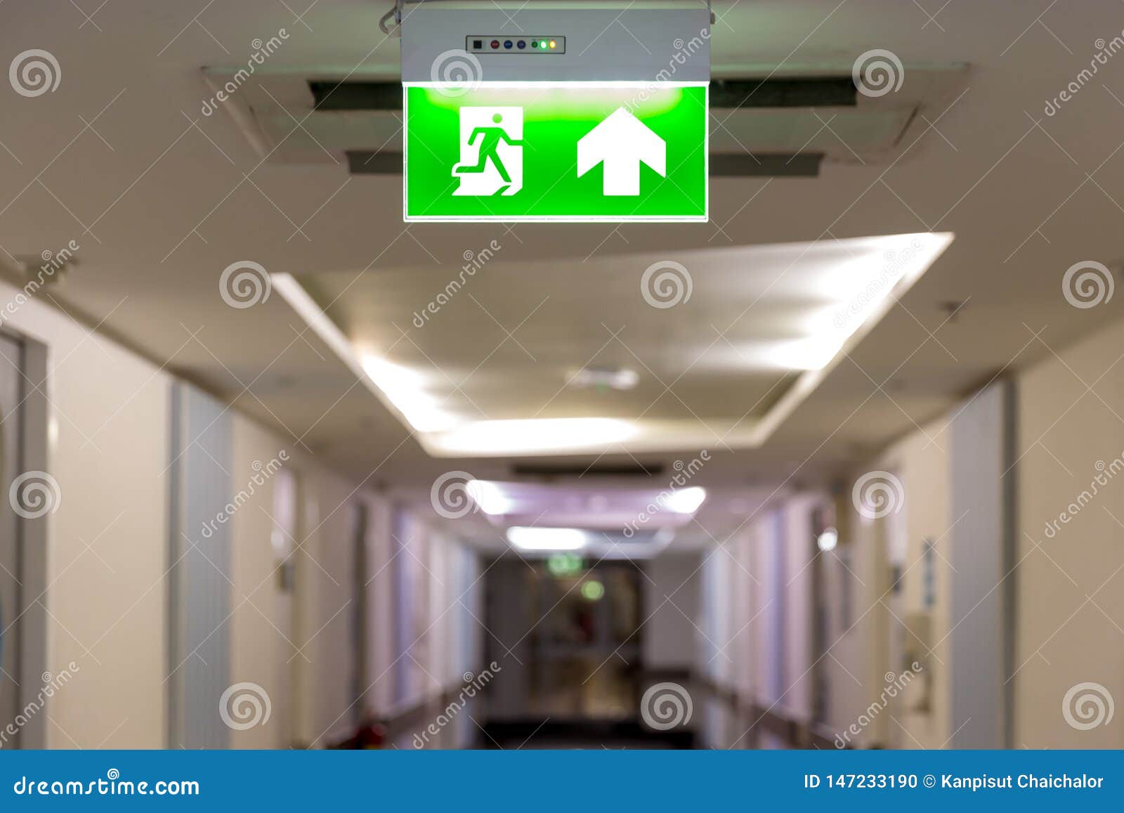 Green Emergency Exit Sign Showing the Way To Escape.Fire Exit in the ...