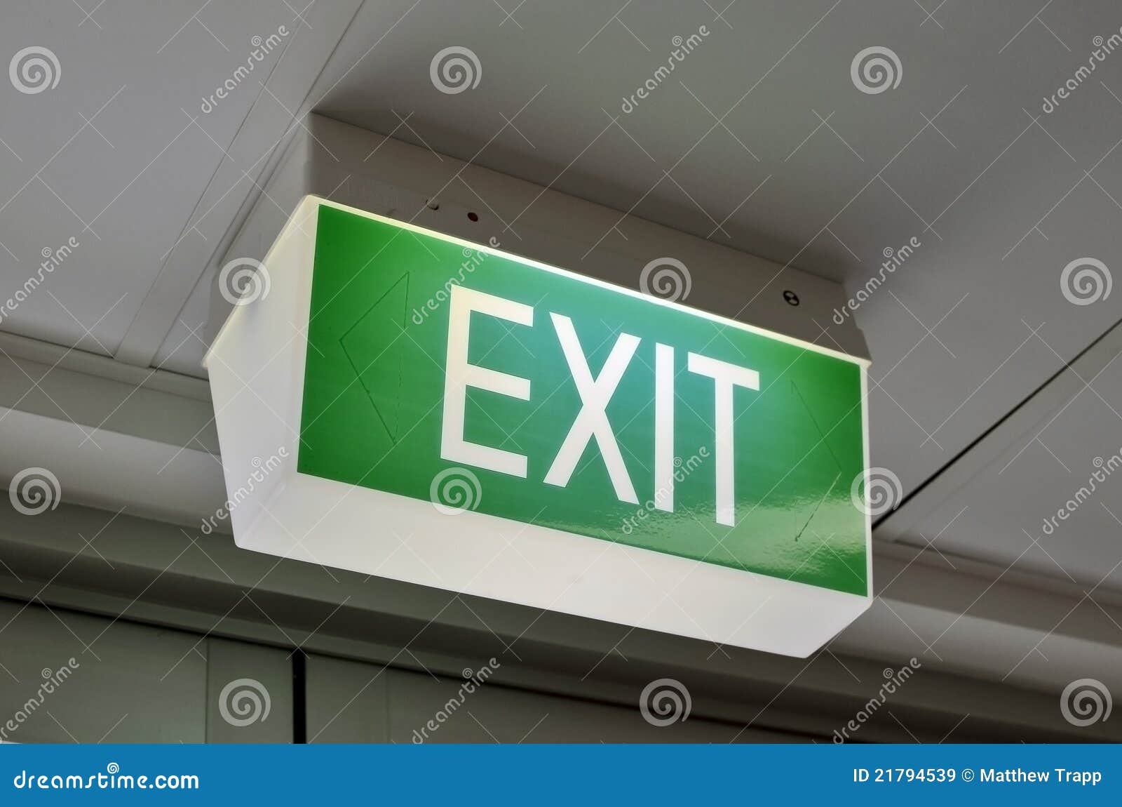 Green Exit Sign With Running Person And Green Arrow Shows Guidance ...