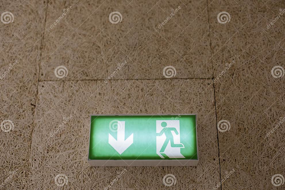 Green Exit Sign Above a Door Stock Image - Image of wall, bright: 161046447