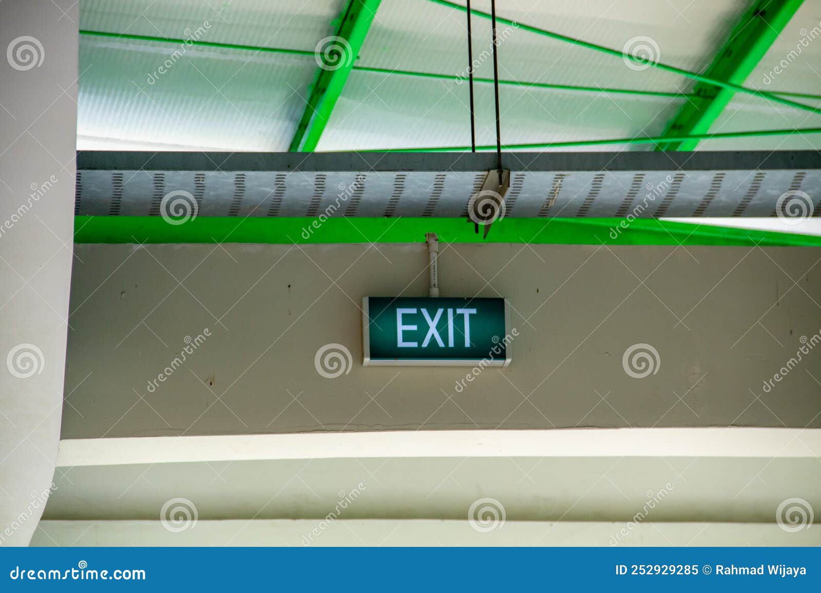 The Green Exit Sign Above the Hall of a Building Stock Image - Image of ...