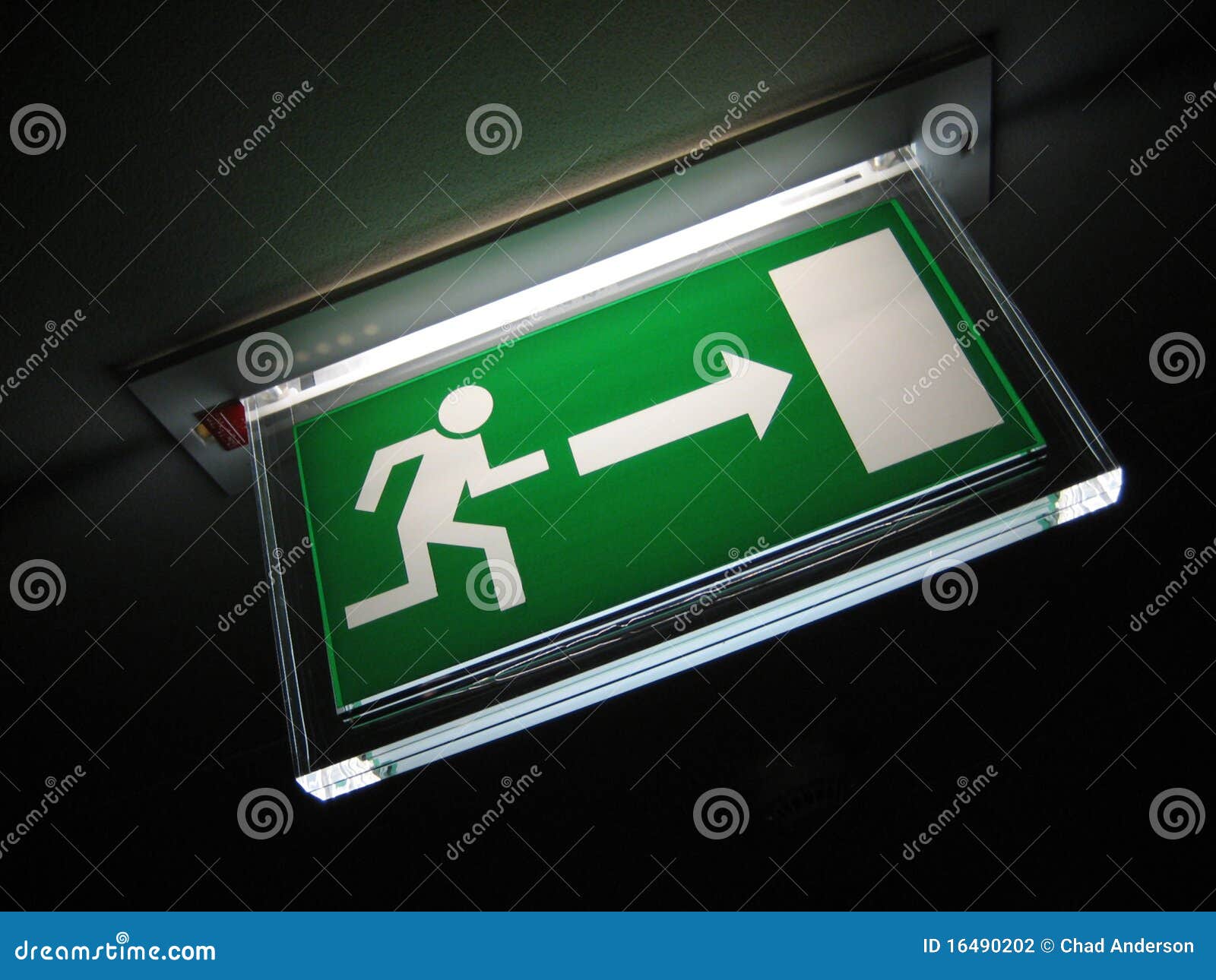 Green Exit Sign With Running Person And Green Arrow Shows Guidance ...