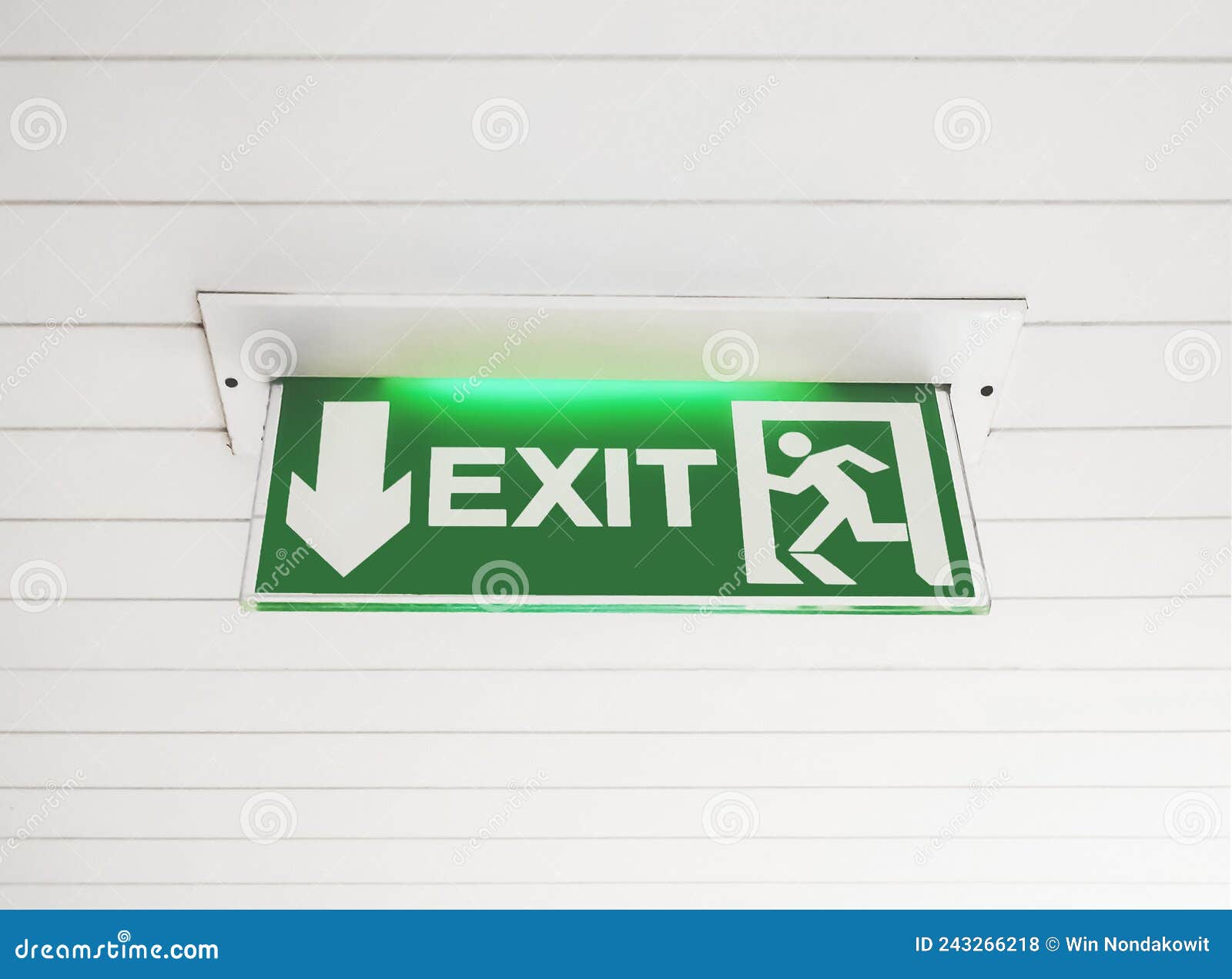 Fire emergency exit sign stock photo. Image of building - 243266218