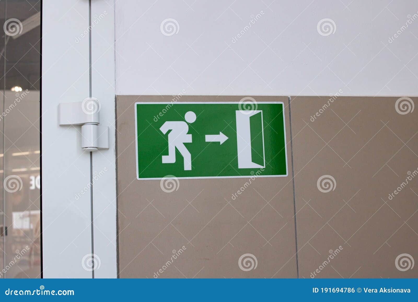Green Exit Sign at Door in Building Stock Photo - Image of office, help ...