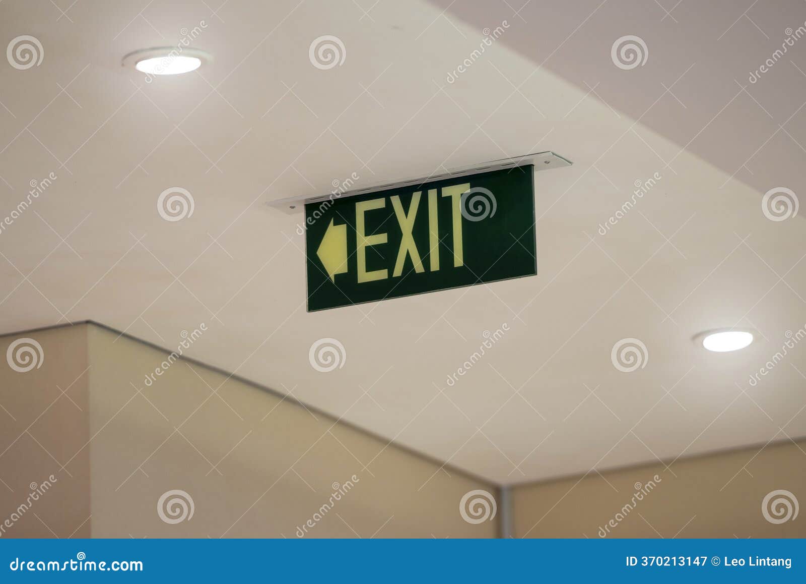 Green Exit Sign With Running Person And Green Arrow Shows Guidance ...