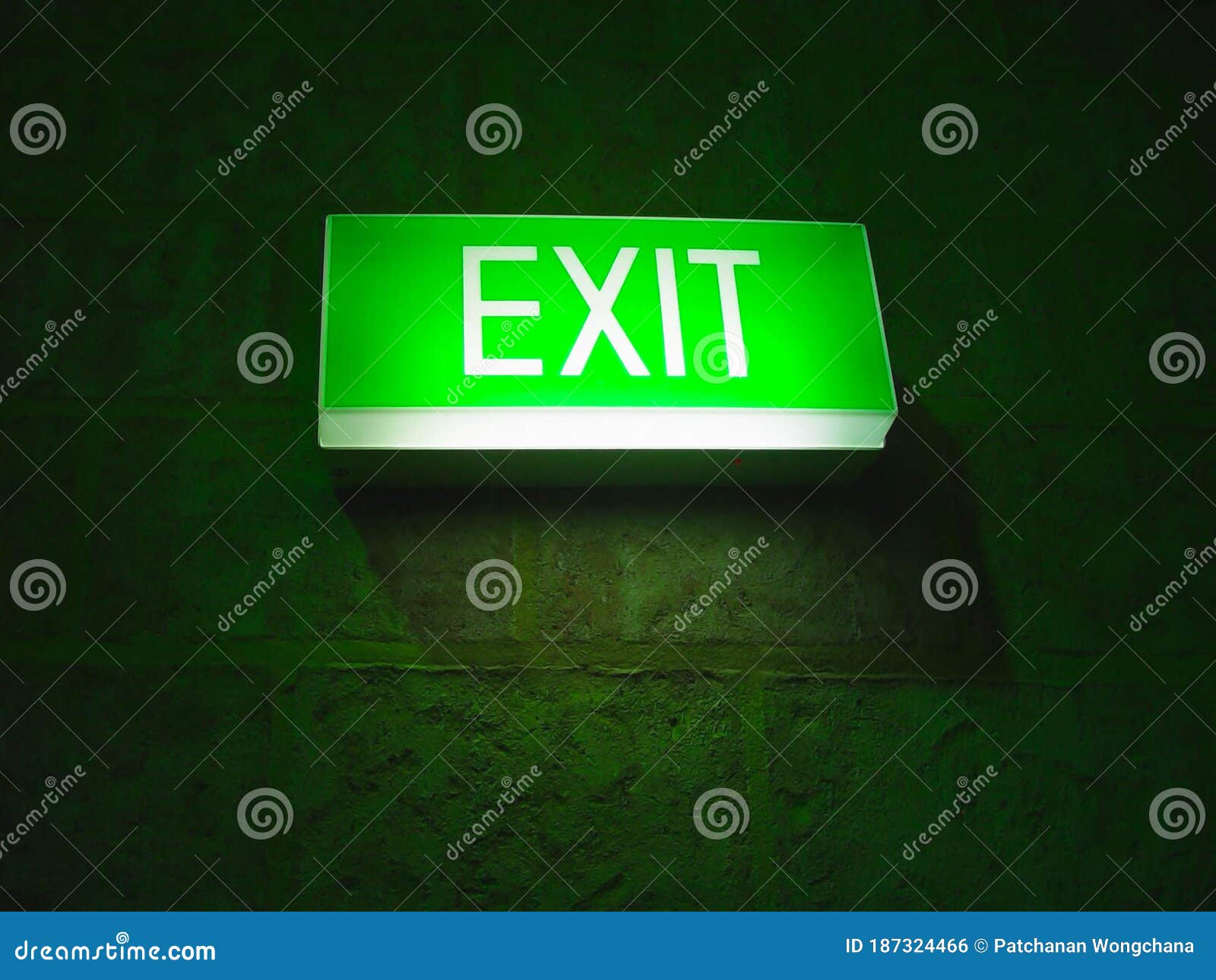 Green exit sign in night stock photo. Image of security - 187324466