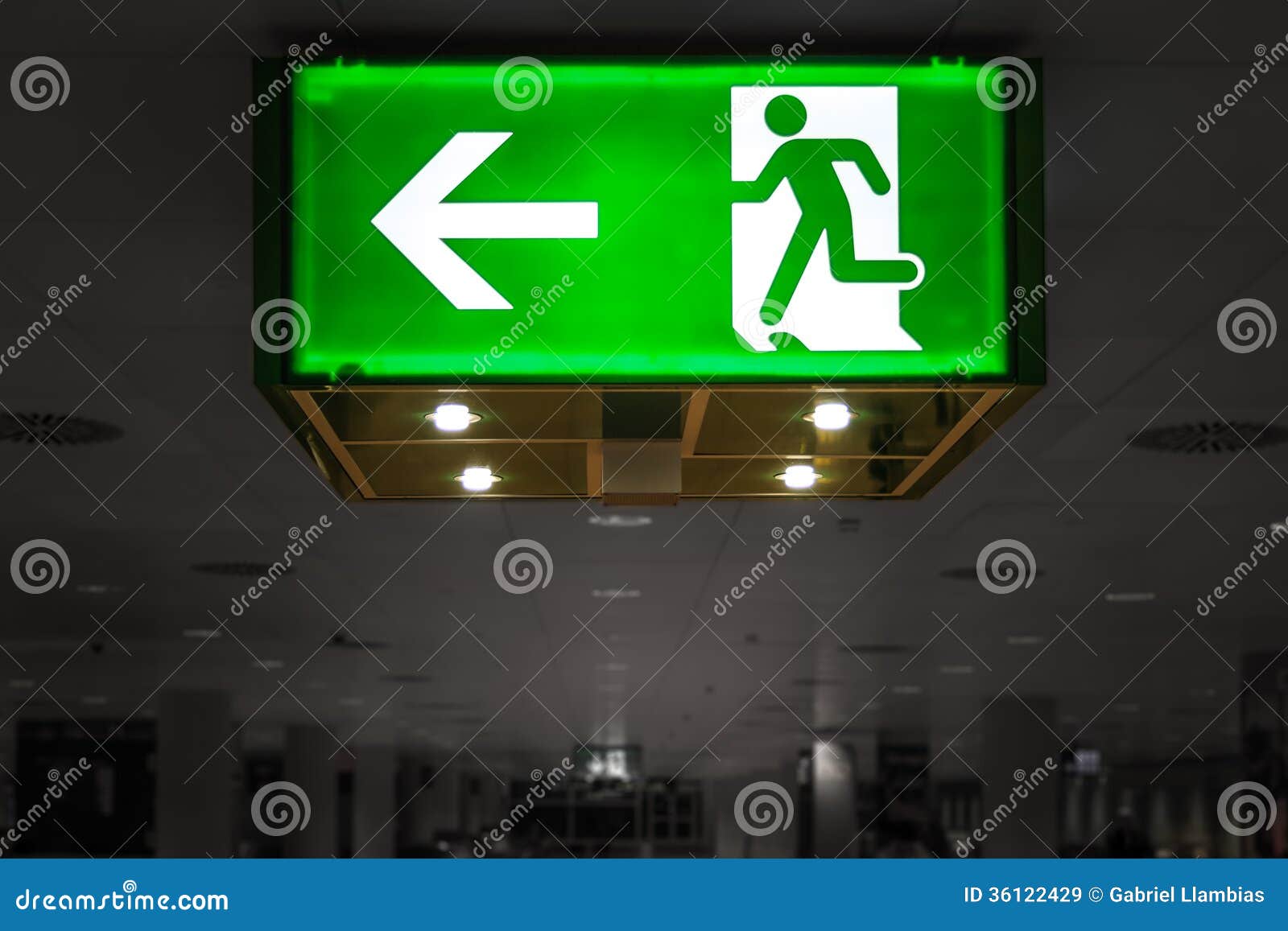 Green Exit Sign With Running Person And Green Arrow Shows Guidance ...