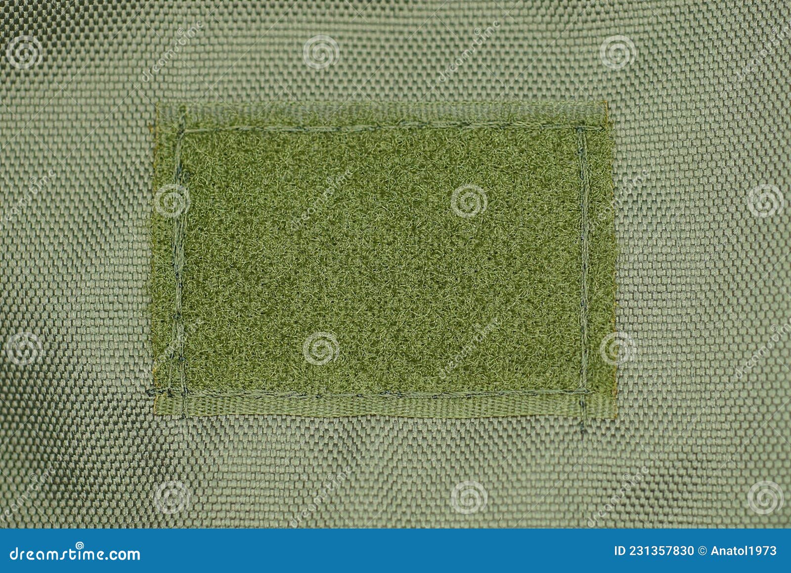 Green Fabric Texture on a One Rectangular Sticky Buckle Stock Photo ...