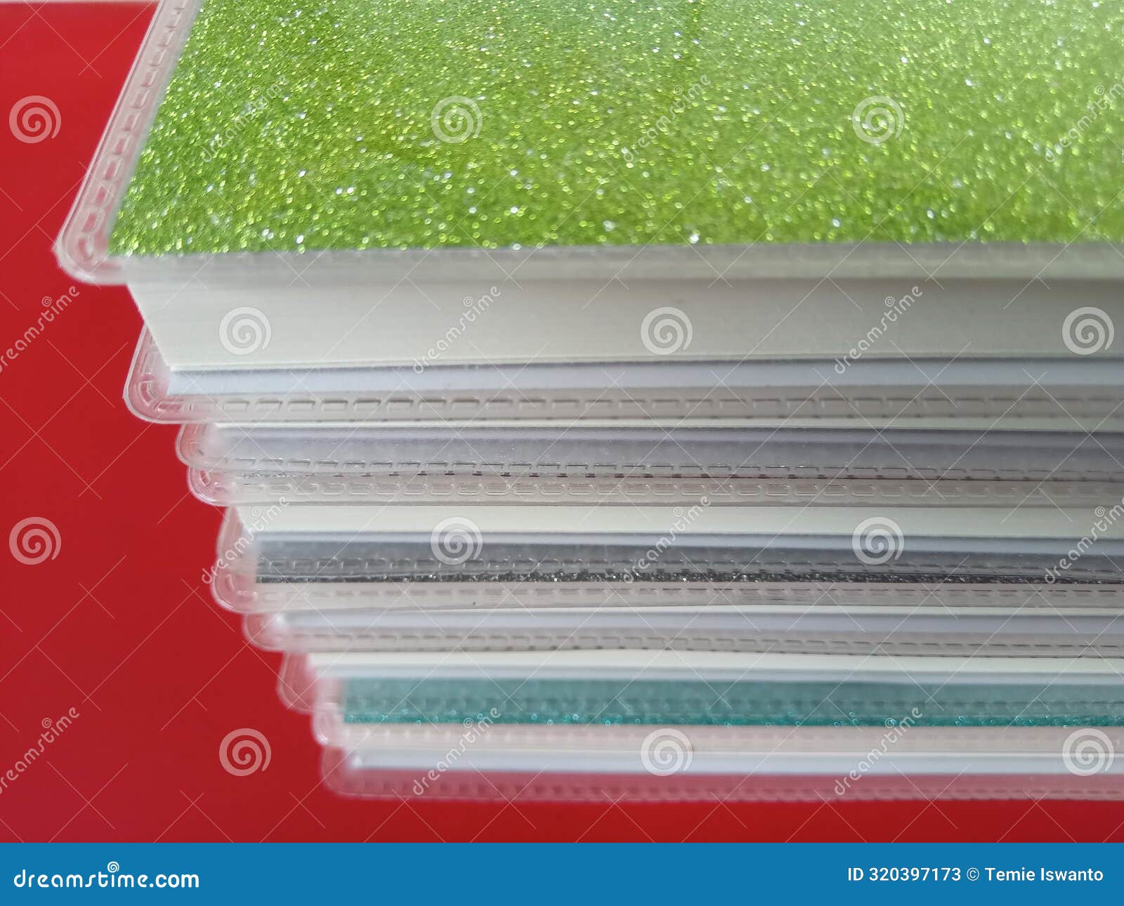 The Green Face Looks Like a Stack of White Paper Notepads with Plastic ...