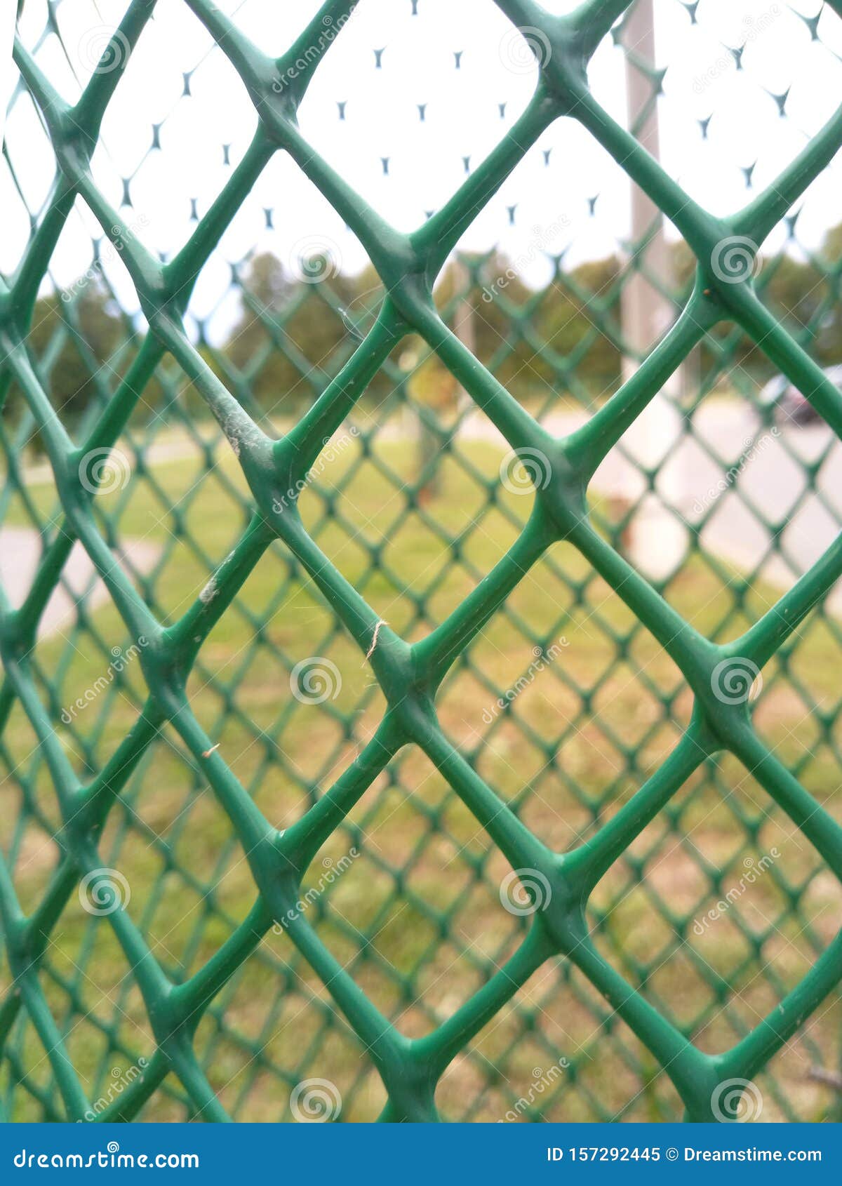 Green fence net stock image. Image of detail, barrier - 157292445