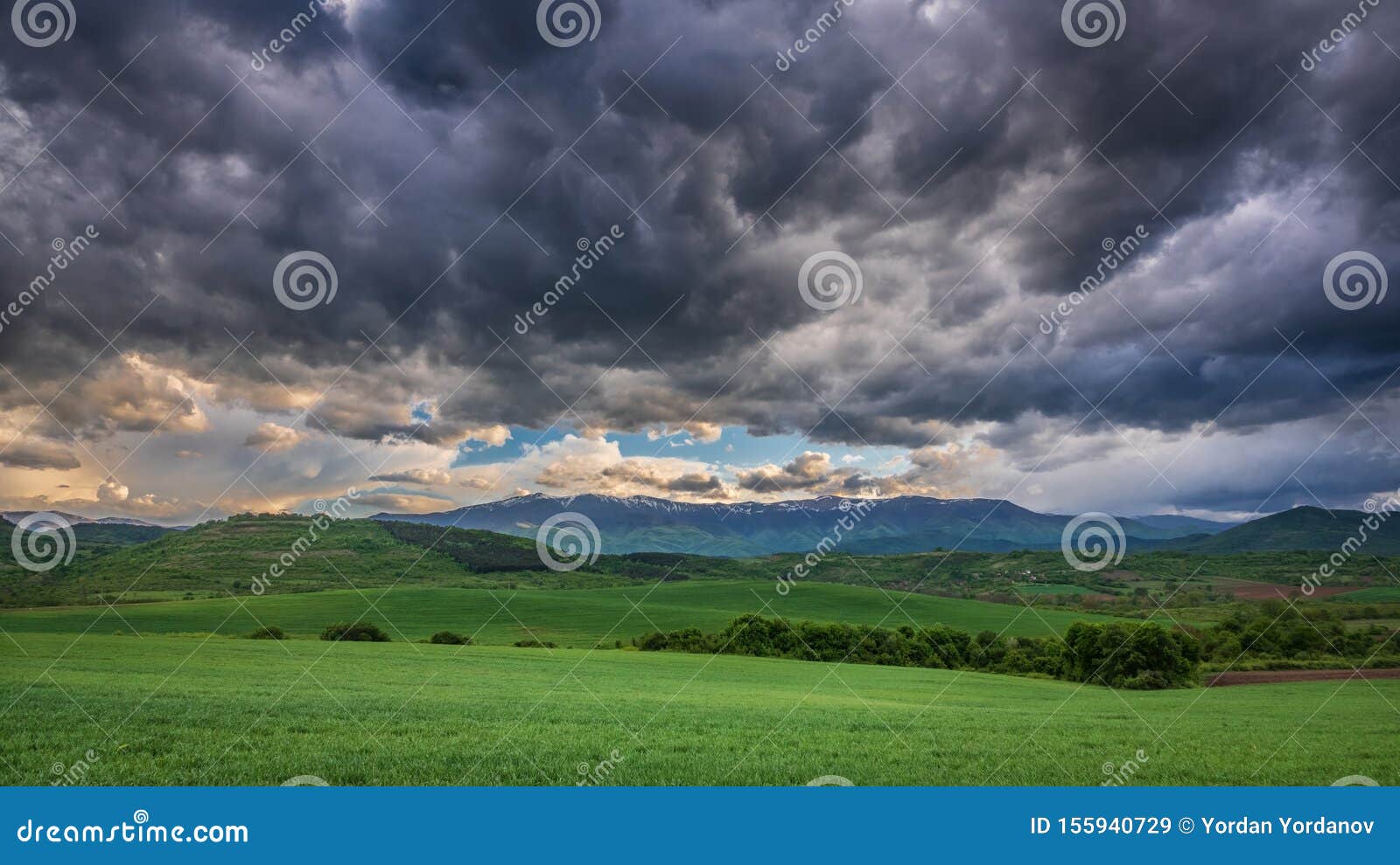 Green Field with Dramatic Clouds Stock Image - Image of green ...