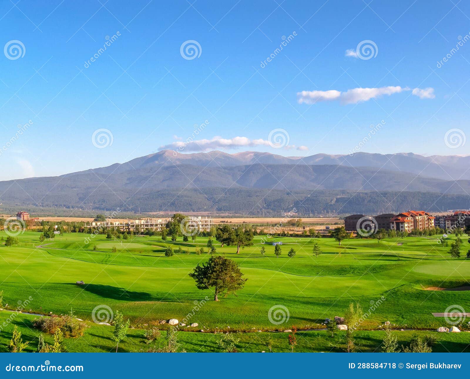 Green Fields on the Background of Clouds and Mountains Stock Photo ...