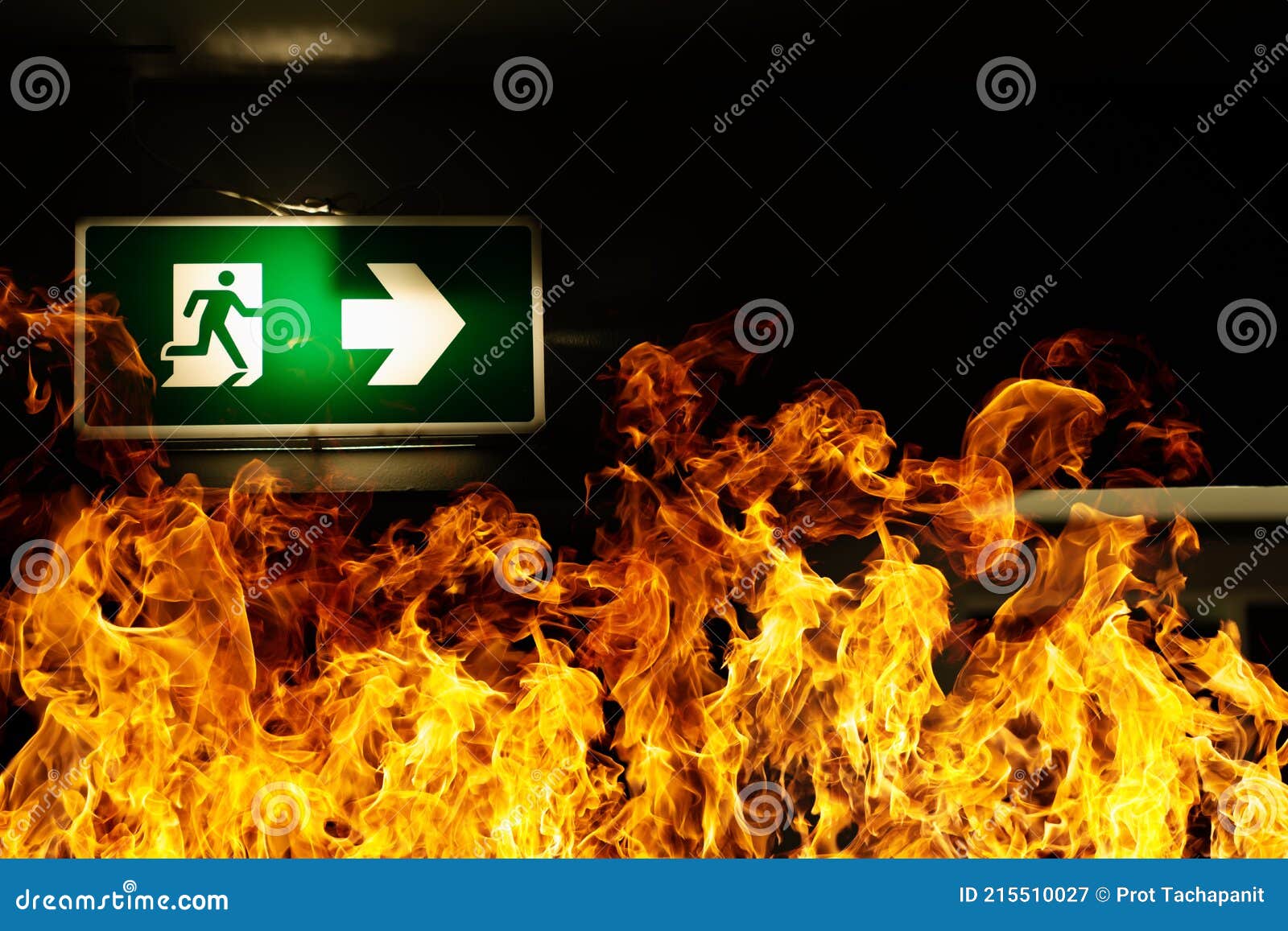 Green Fire Escape Sign Hang on the Ceiling in the Warehouse. the ...