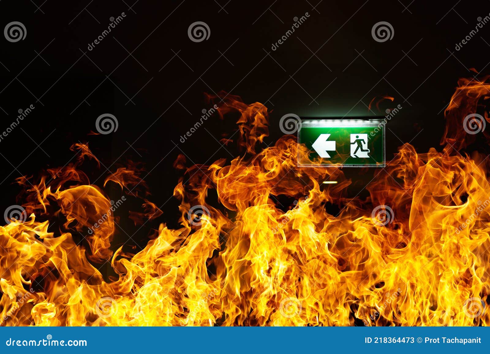 Green Fire Escape Sign Hang on the Ceiling in the Warehouse. the ...