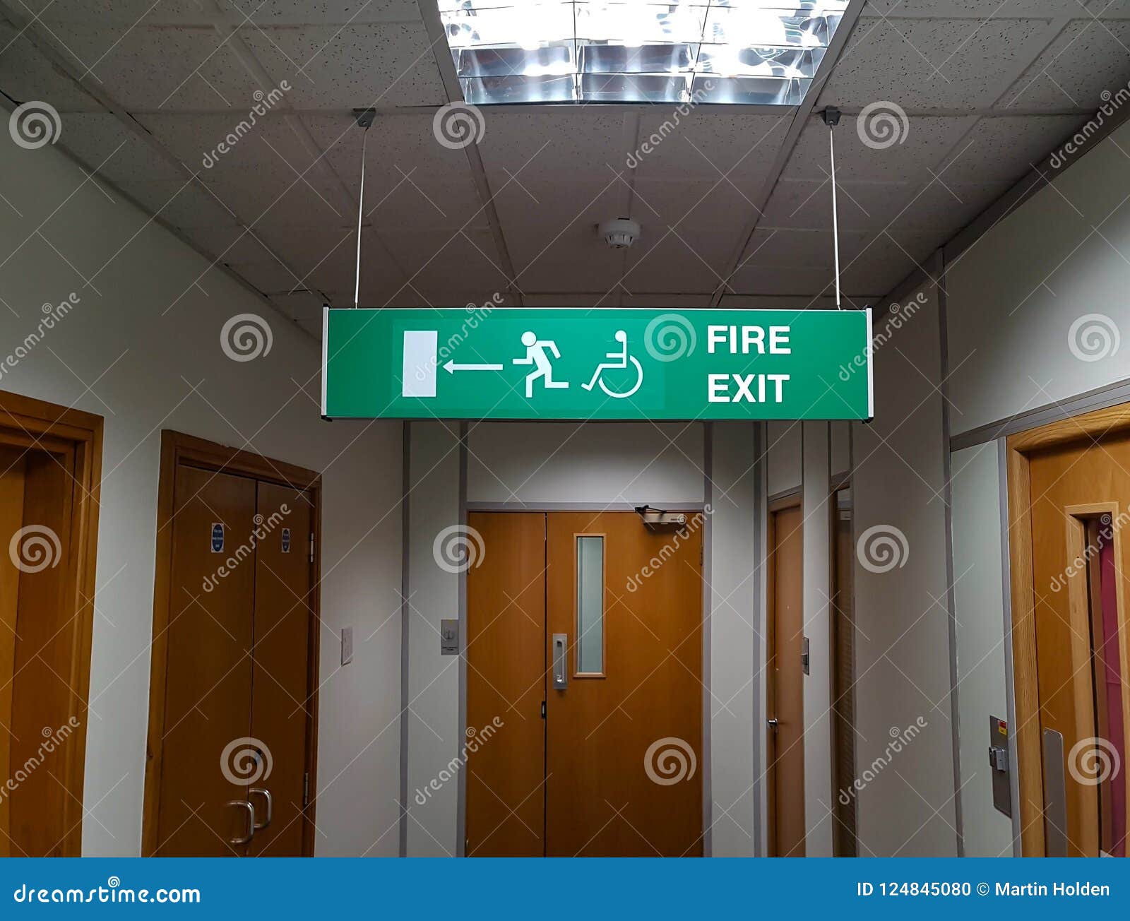 Green Fire Exit Sign stock photo. Image of work, door - 124845080