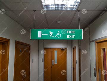 Green Fire Exit Sign stock photo. Image of work, door - 124845080