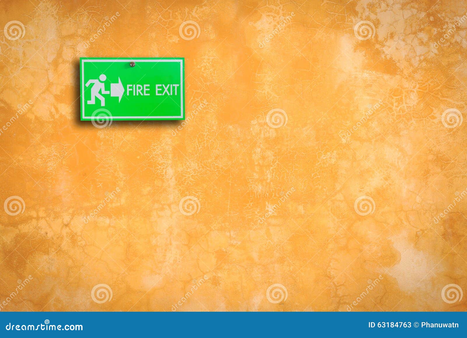 Green Fire Exit Sign on Stone Wall Stock Image - Image of light ...