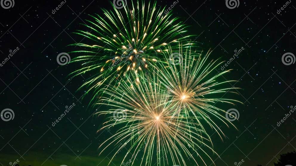 Green Fireworks Exploding in Night Sky with Stars Stock Image - Image ...