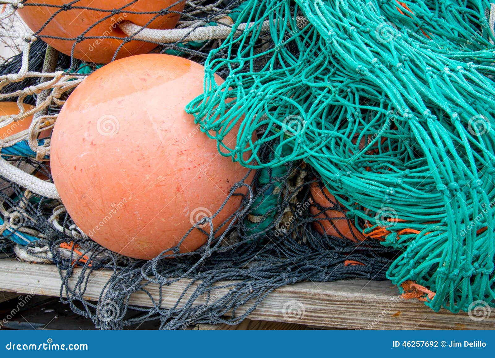 Green Fishing Nets with Orange Buoy Float Stock Photo - Image of black ...