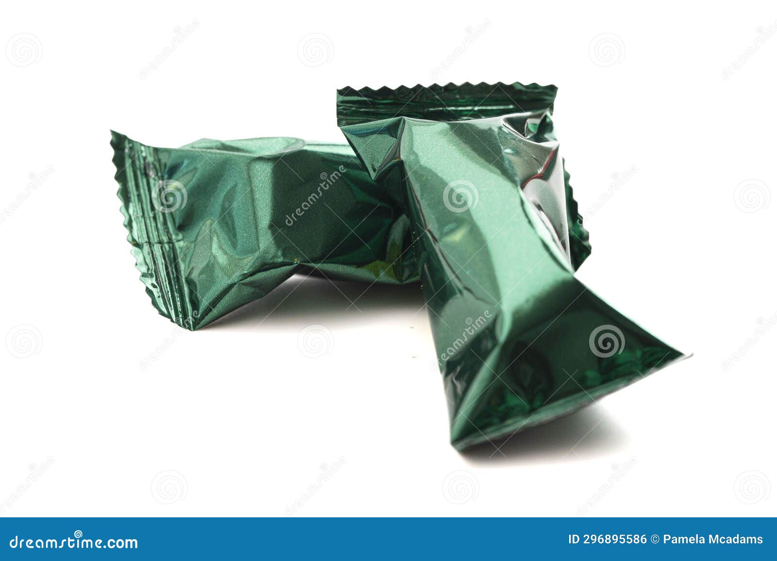 Green Foil Wrapped Chocolate Truffles Isolated on a White Background ...