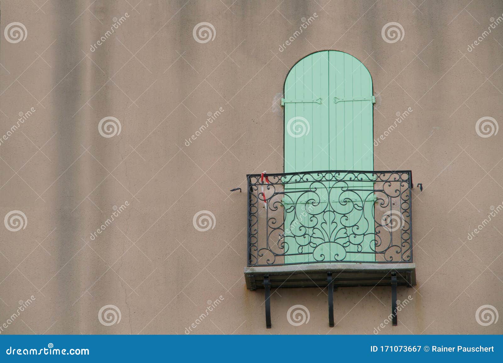 Green Folding Shutter Behind a Metal Balcony Stock Image - Image of ...