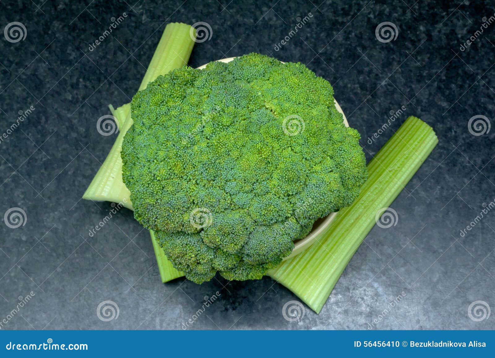 Green Fresh Vegetables. Whole Broccoli in a Bowl with Celery on the ...