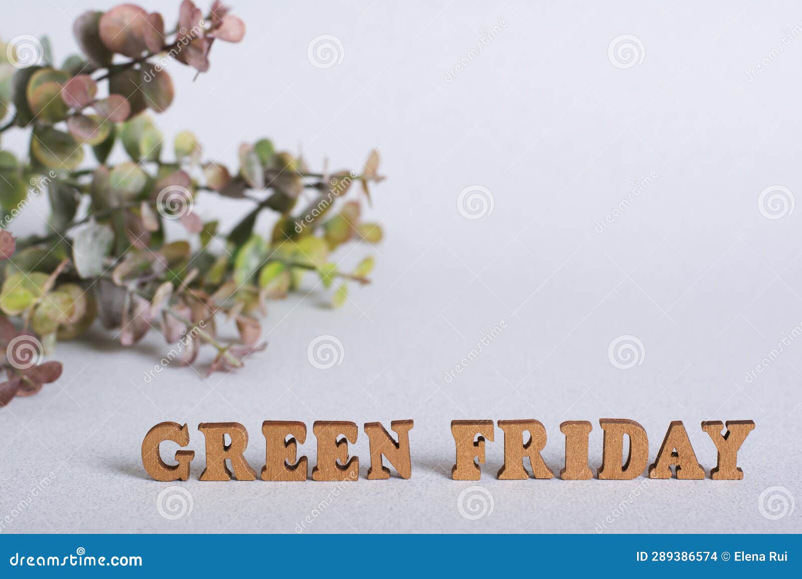 Green Friday Concept Letters and Branch on Green Background Stock Photo ...