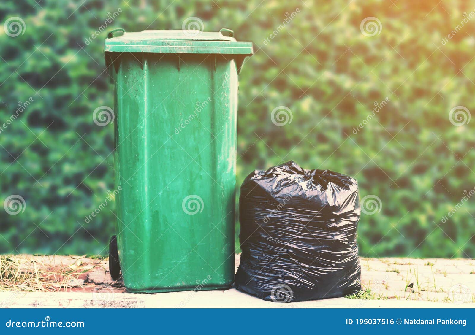 Green garbage bin stock photo. Image of junk, hand, full - 195037516