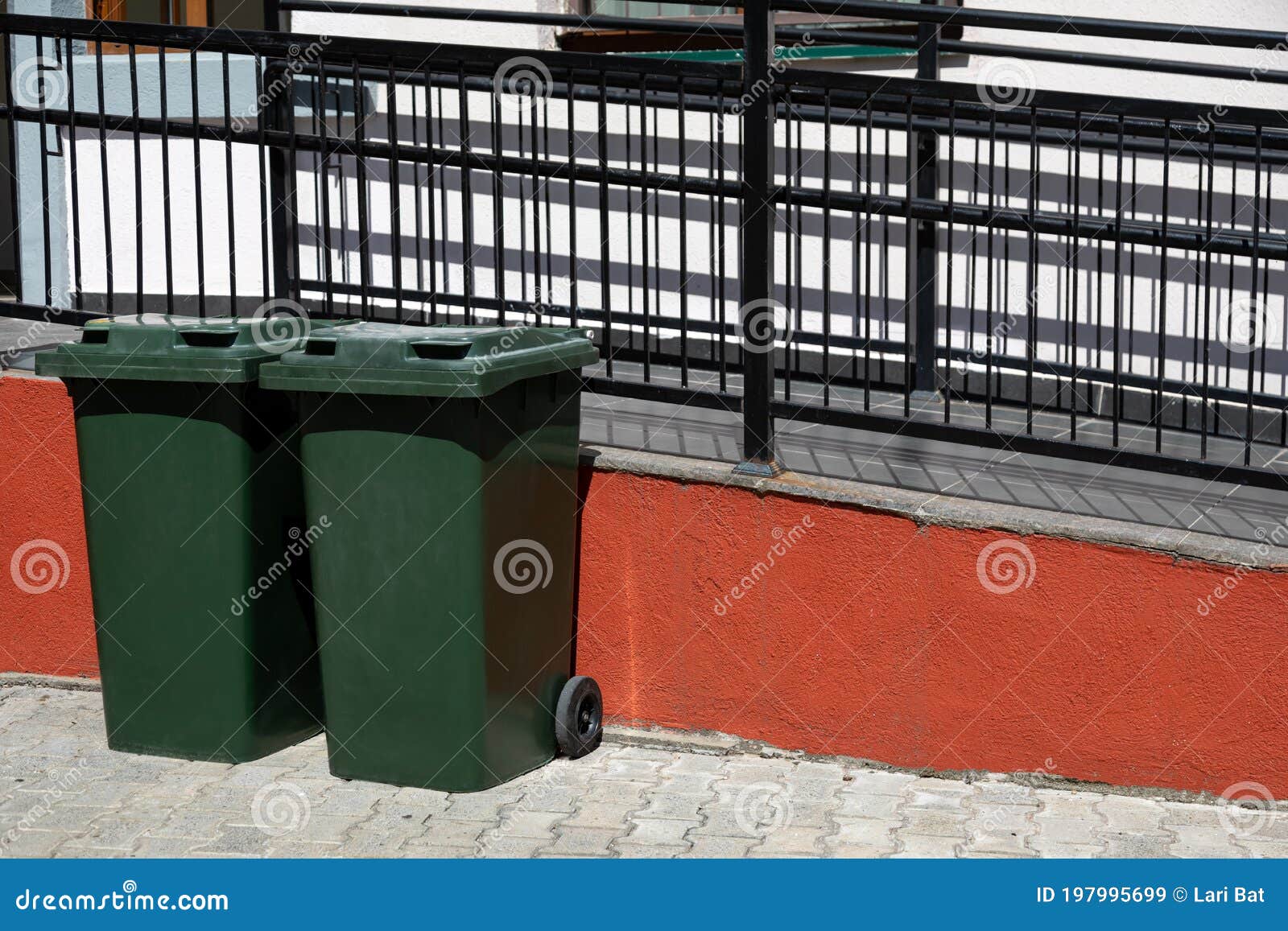 Green Garbage Bins in Front of the House.Public Trash on the Side of ...