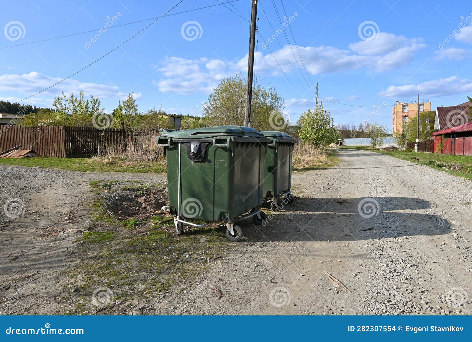 Green Garbage Cans on the Road in the Village Stock Photo - Image of ...
