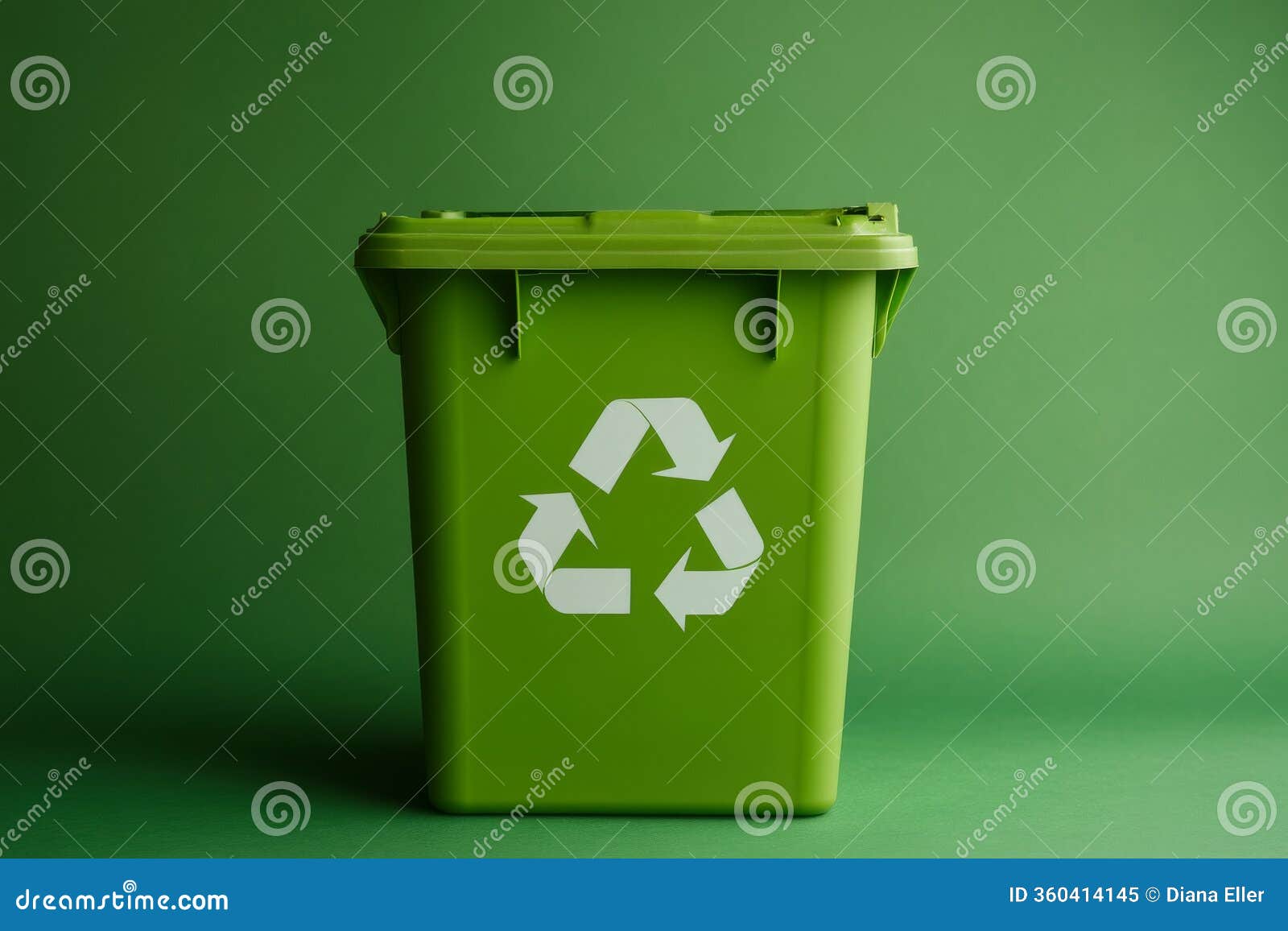 Green Garbage Container with Recycle Symbol on Green Studio Background ...