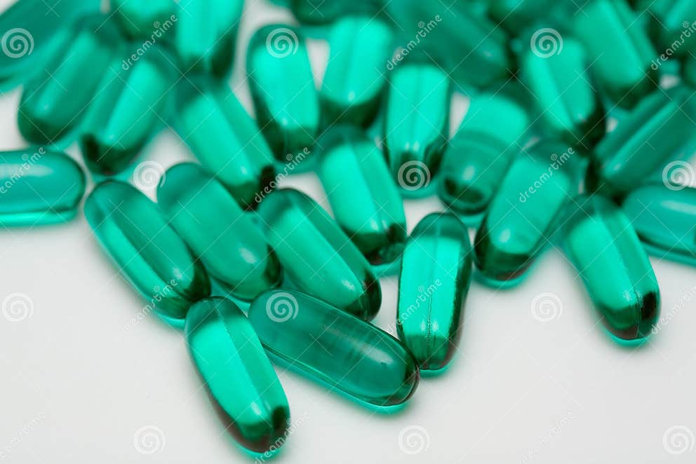 Green gel pills stock image. Image of capsule, diet, multivitamin - 621833