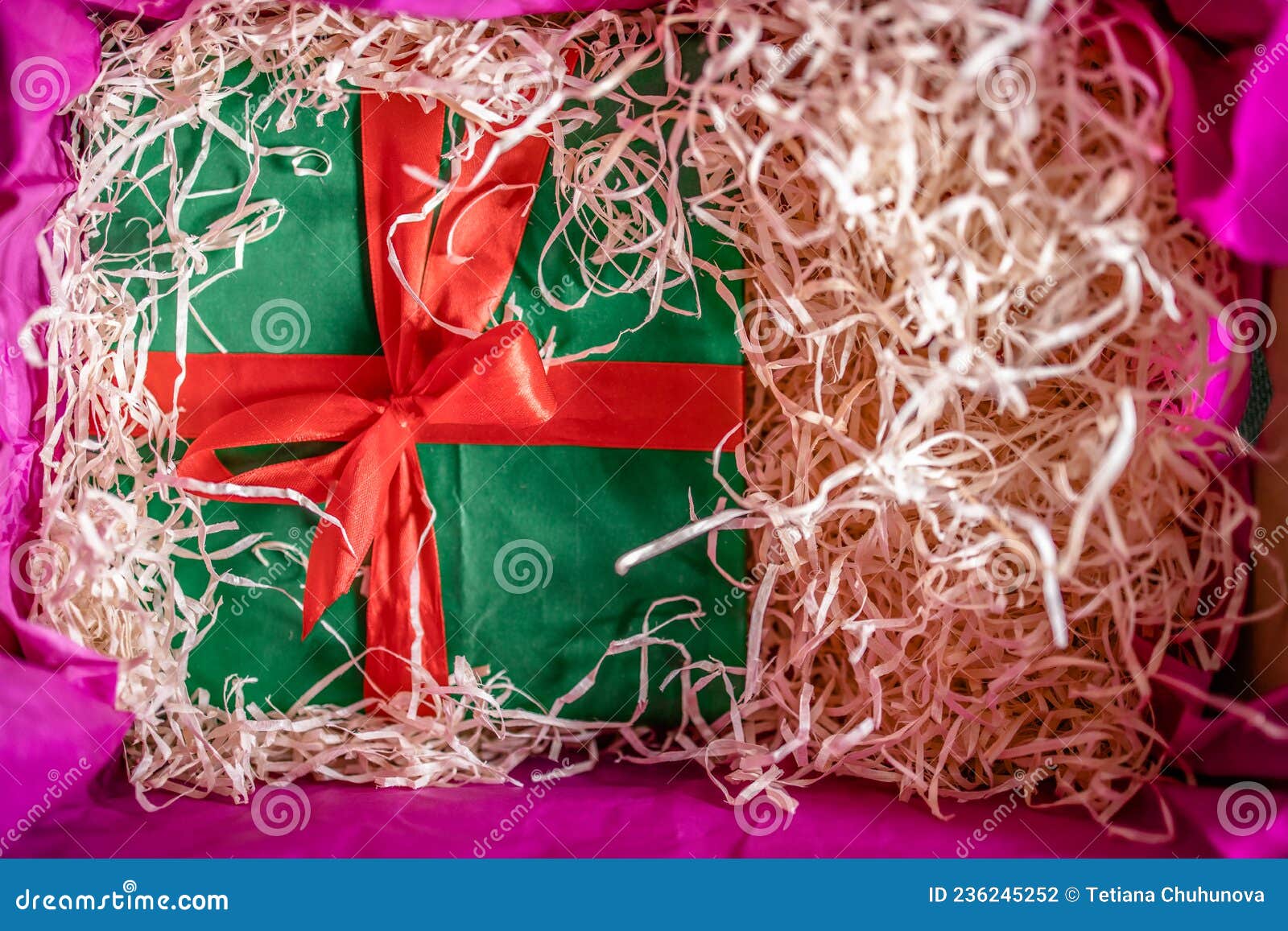 Green Gift Box Hidden in a Box with Shavings. Stock Photo - Image of ...