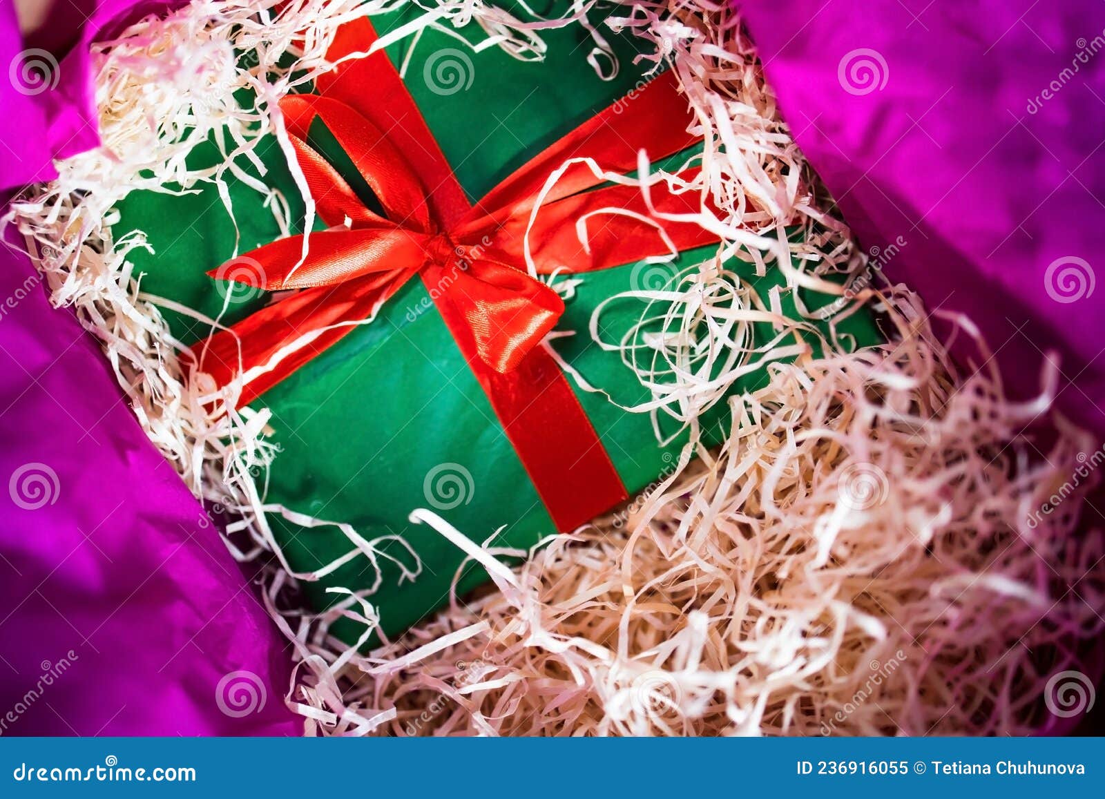Green Gift Box Hidden in a Box with Shavings. Stock Image - Image of ...
